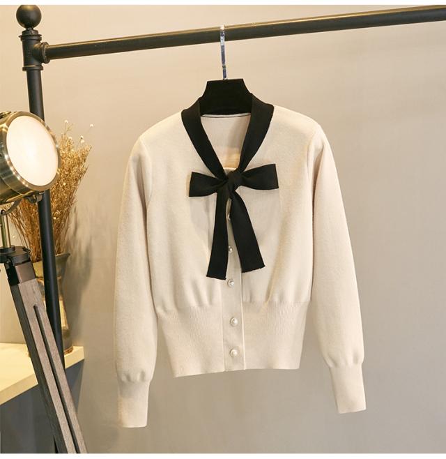 リボン付き クロップド リブ カーディガン トップス アウター ショート ショート丈 袖あり 長袖 Vネック タイト リボン 前開き リブニット 編み込み パールボタン かわいい 大人可愛い きれいめ シンプル カジュアル 大人 上品 おしゃれ 大人女子 ラブリー キュート ガーリー