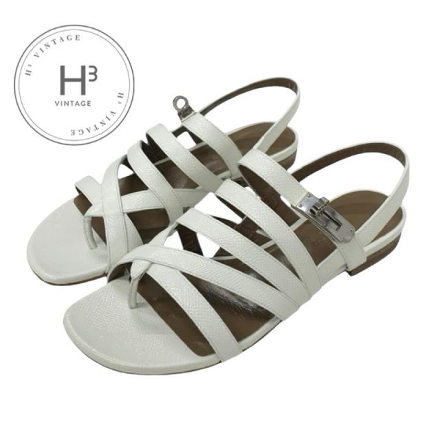 エルメス HERMES サンダル 靴 シューズ レザー ホワイト 白 シルバー トング フラット ケリー金具 ストラップ